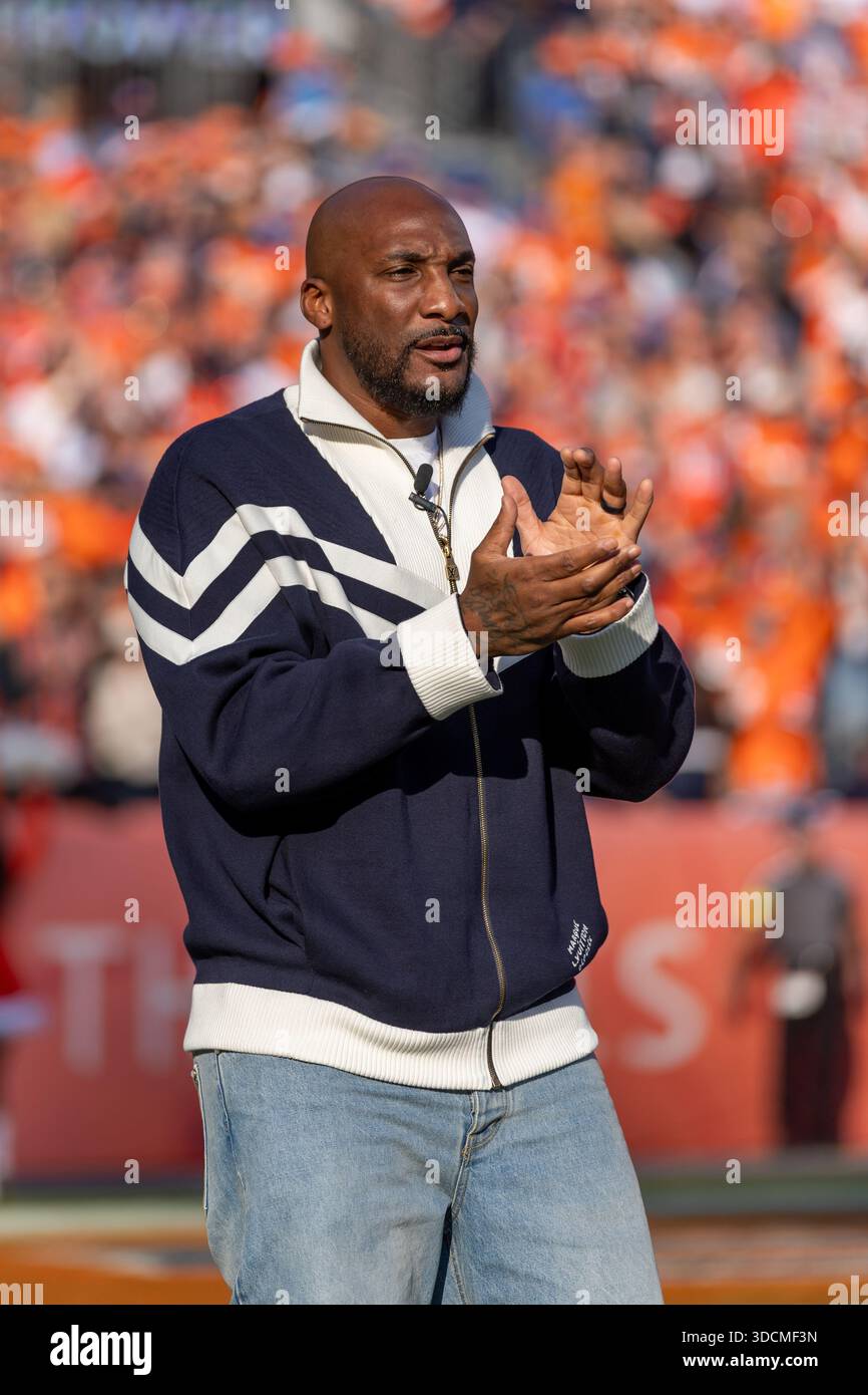 Ex-Denver Broncos player Aqib Talib stands on the field before the ...