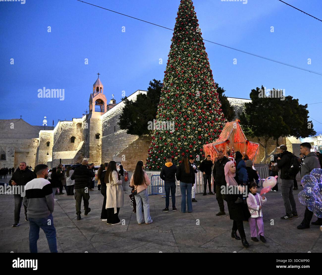 Palestinians visit Manger Square outside the Church of Nativity, where ...