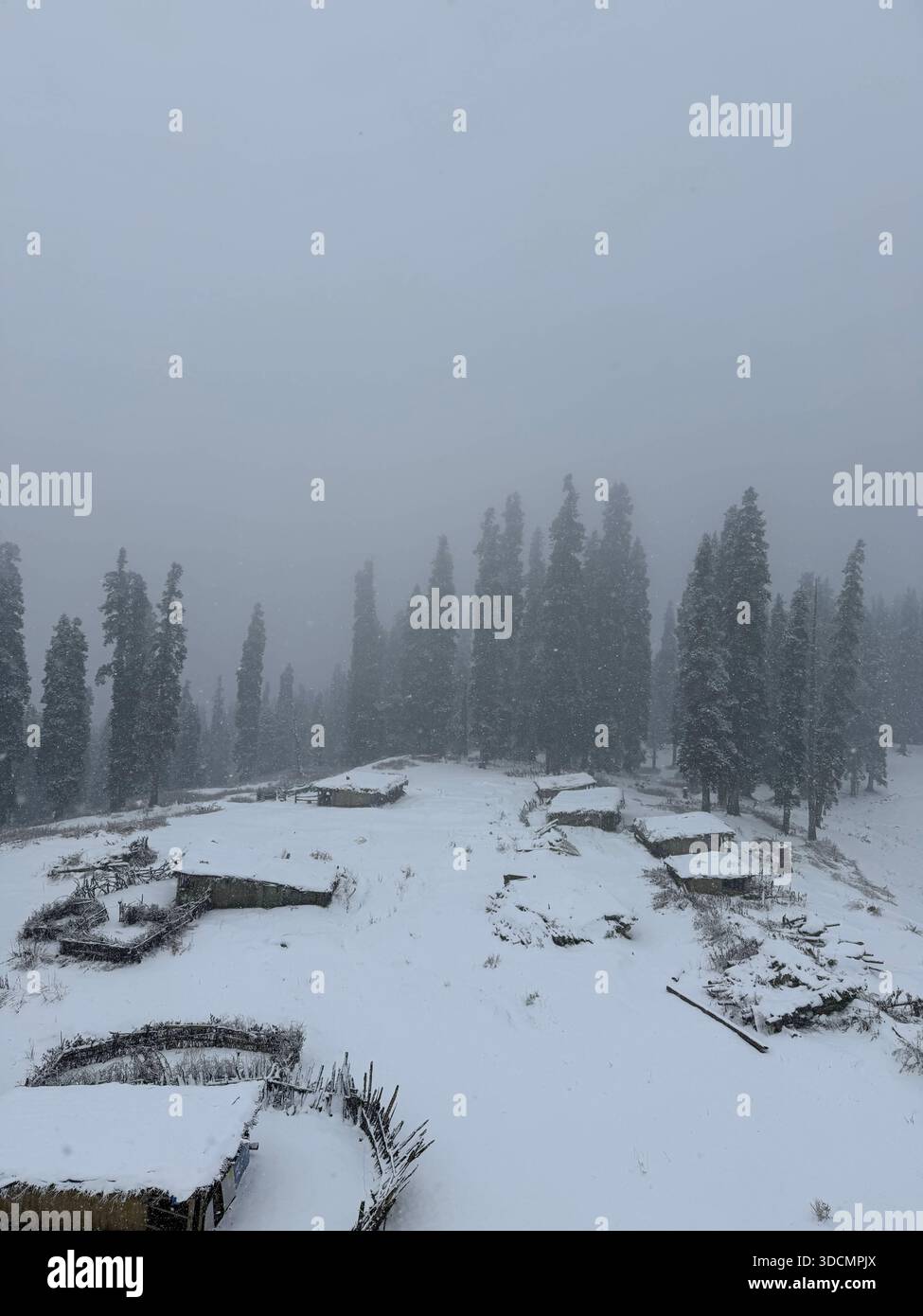 Small huts are seen during active snowfall in Gulmarg, Jammu and ...