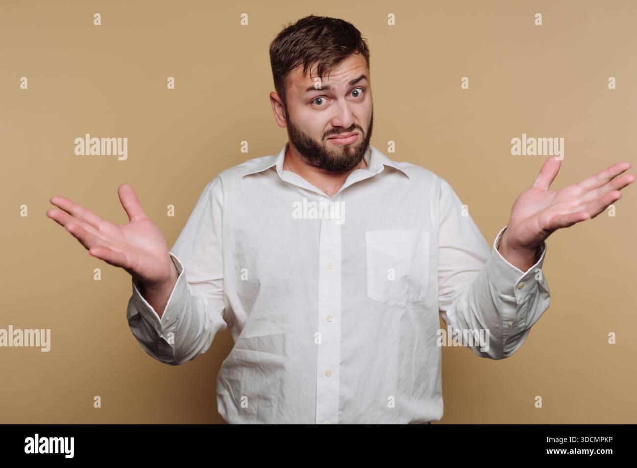 Man raises hands questioning hi-res stock photography and images - Alamy