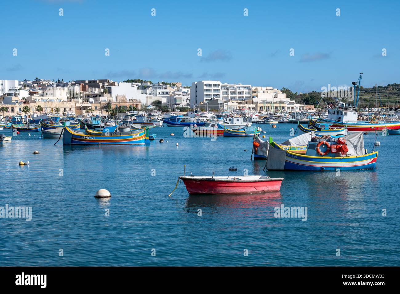 Summer atmosphere in the coastal village of Marsaxlokk with colorful ...