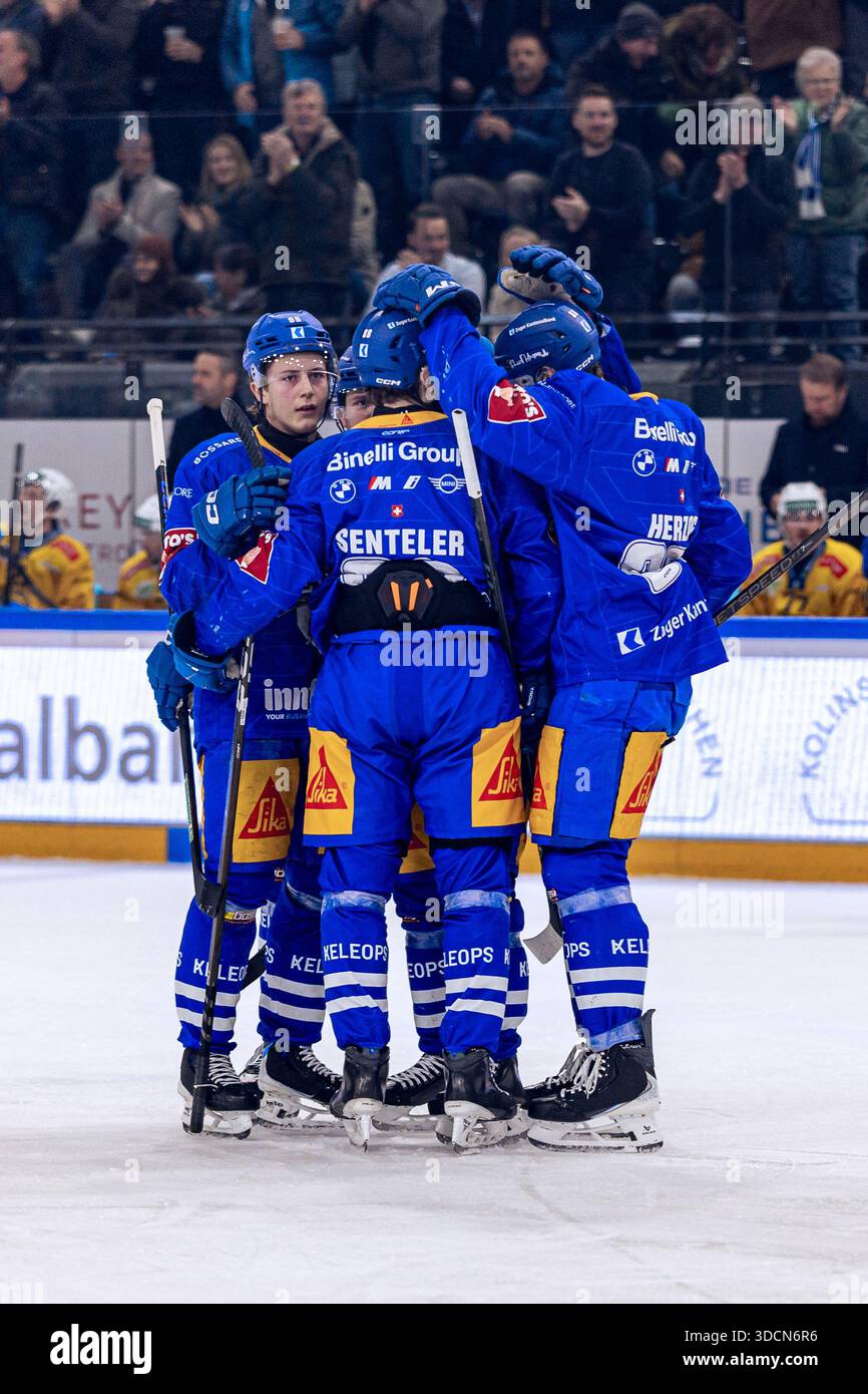 Goal scorer Colin Lindemann #95 (EV Zug) celebrates with his teammates ...
