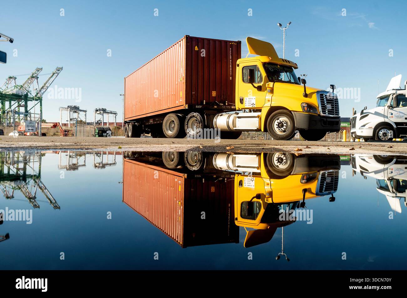 FILE - A truck departs from a Port of Oakland shipping terminal on Nov ...