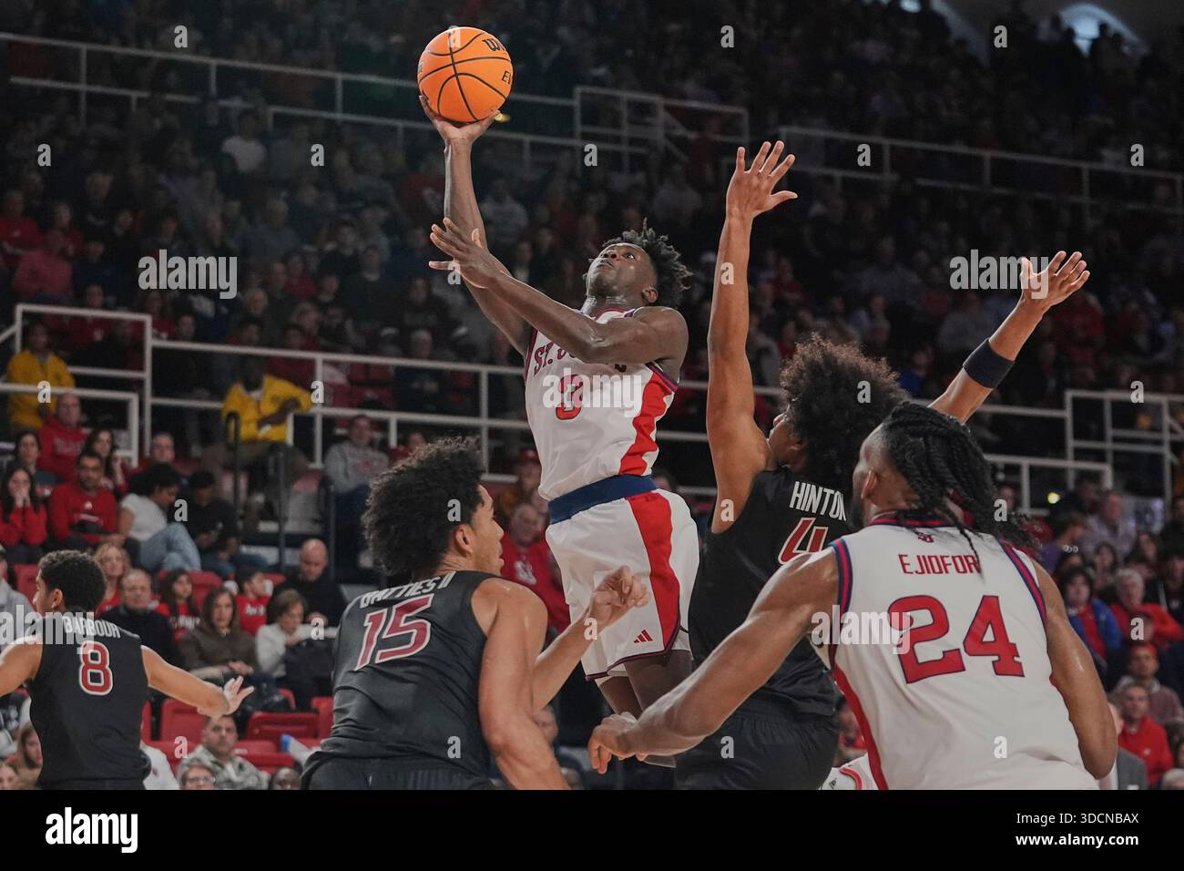 St. John's Joson Sanon (3) shoots over Harvard's Thomas Batties II (15 ...