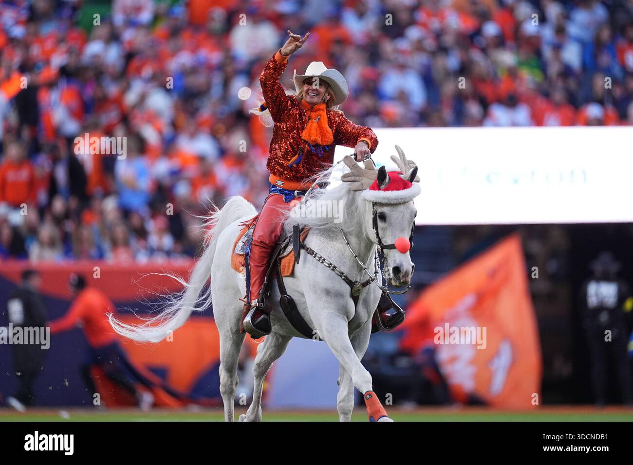 Ann Judge rides Denver Broncos mascot Thunder in the first half of an ...