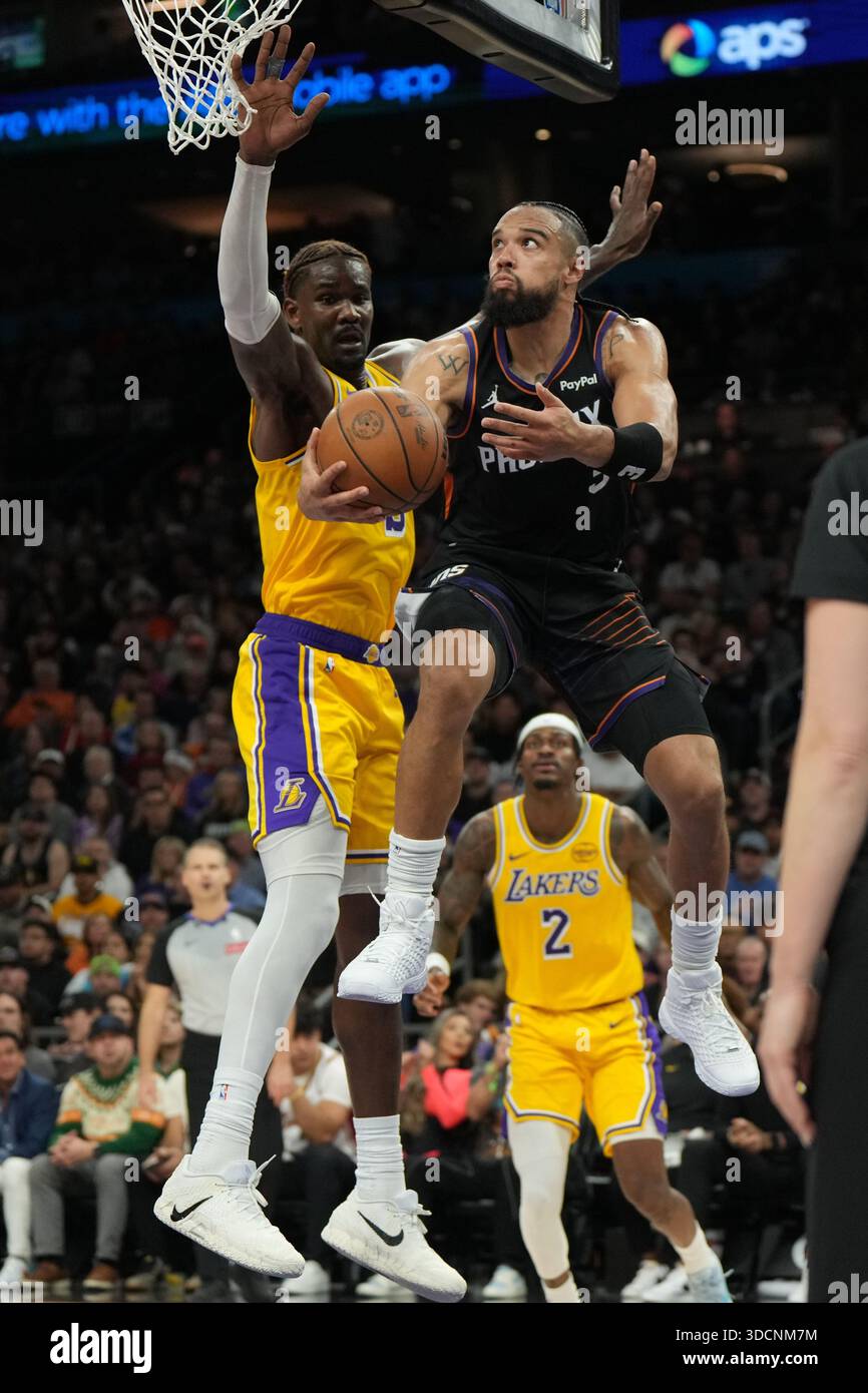 Phoenix Suns forward Dillon Brooks scores on Los Angeles Lakers center Deandre Ayton (5) during ...