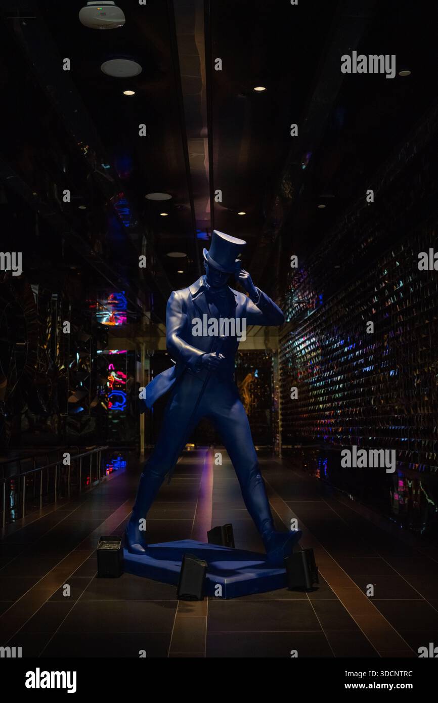 Blue performer statue in dramatic pose with hat and cane Stock Photo ...