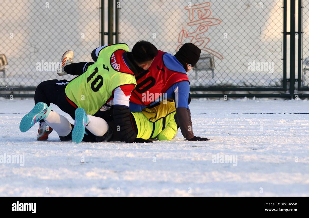 A snow football match is held at the Harbin Ice-Snow World in Harbin ...