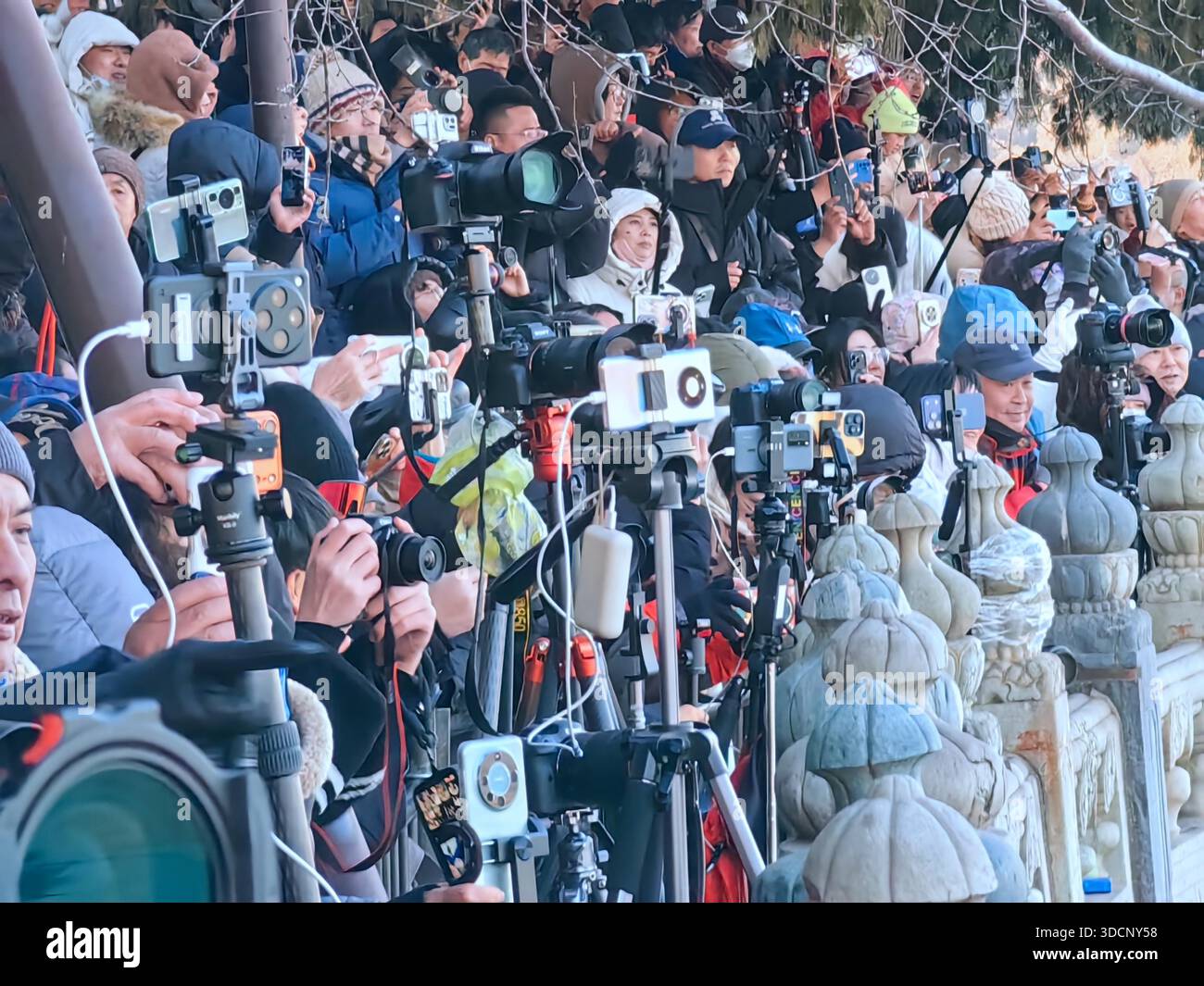 Sunset rays illuminate the Seventeen-Arch Bridge at the Summer Palace ...