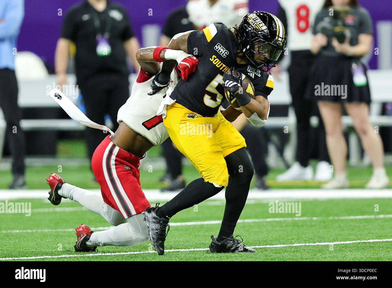 Dec 23, 2025: Southern Miss running back Matt Jones (5) drags Western ...