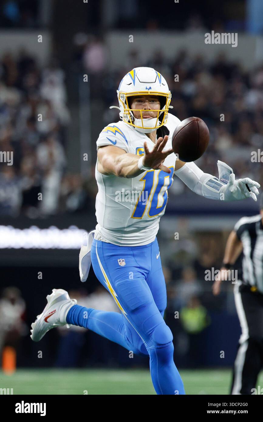 Los Angeles Chargers quarterback Justin Herbert (10) flips a pass ...