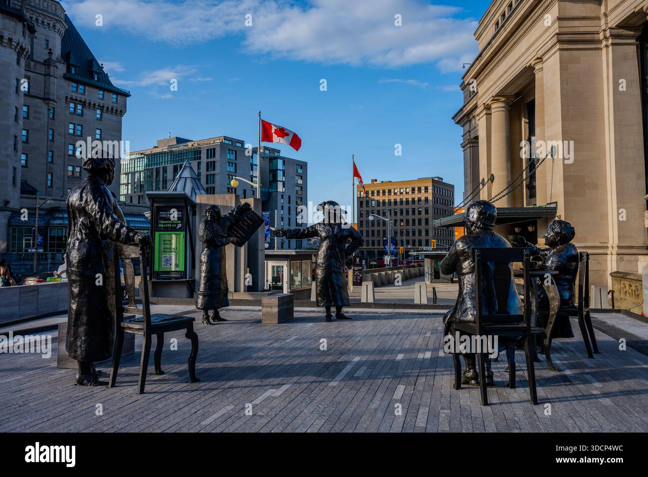 Bronze statues of the Women Are Persons monument stand in a plaza ...