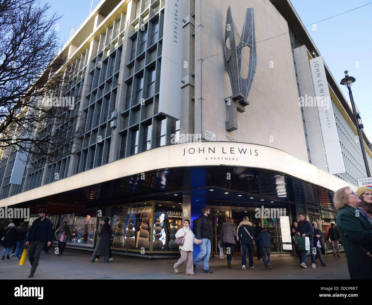 Christmas shoppers walk past the John Lewis flagship store on Oxford ...