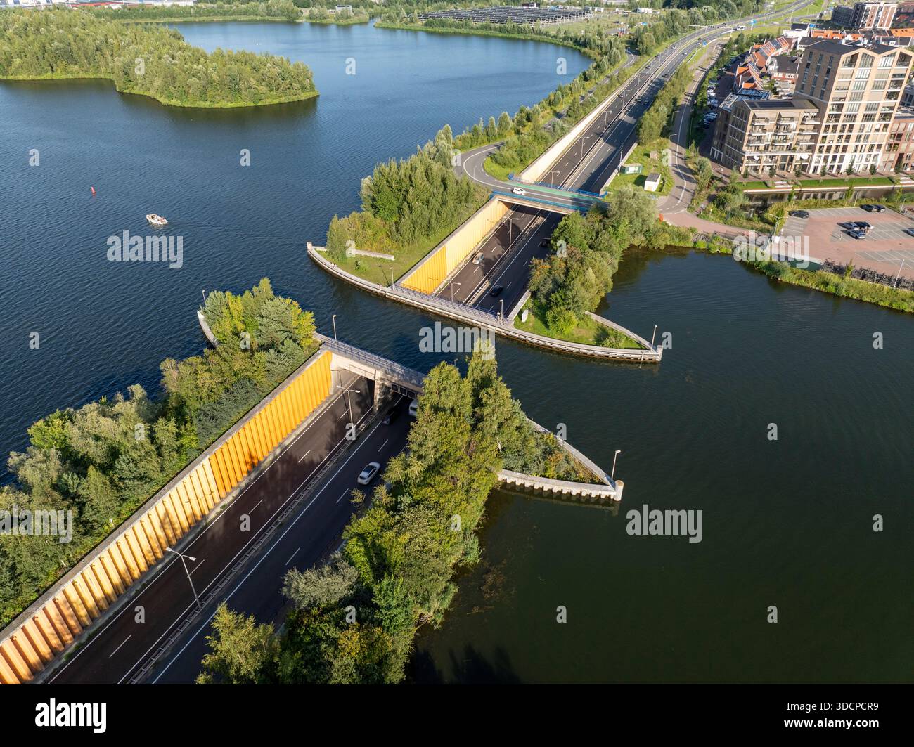 Veluwemeer Aqueduct, road crosses under a waterway in the Netherlands ...