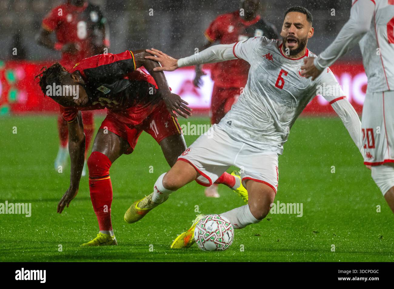 Steven Mukwala of Uganda fights for the ball with Dylan Bronn of ...