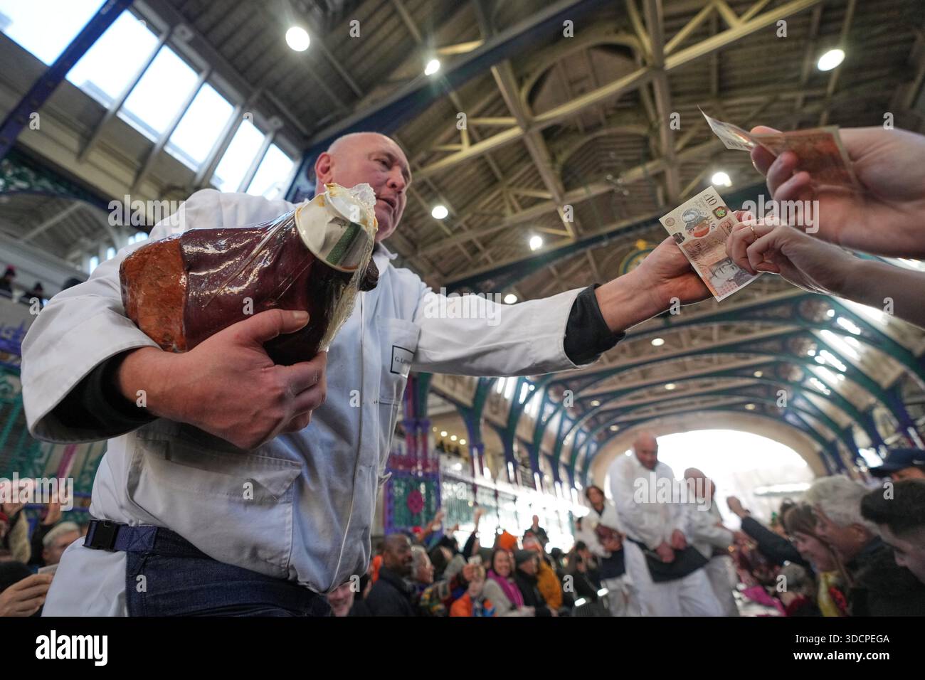A piece of meat is sold during the annual Christmas Eve meat auction at ...