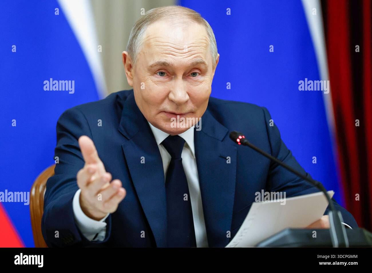 Russian President Vladimir Putin gestures while speaking at a cabinet ...