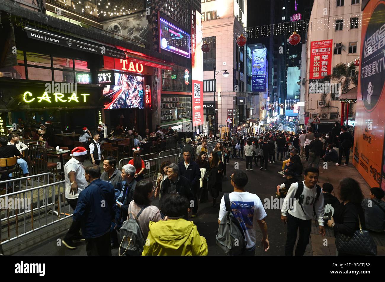 The visitors walking at the Lan Kwai Fong in Central on December 24 ...