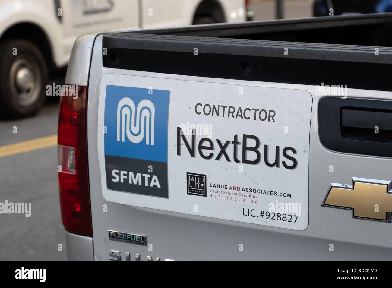 SFMTA contractor NextBus decal on the tailgate of a parked Chevrolet ...