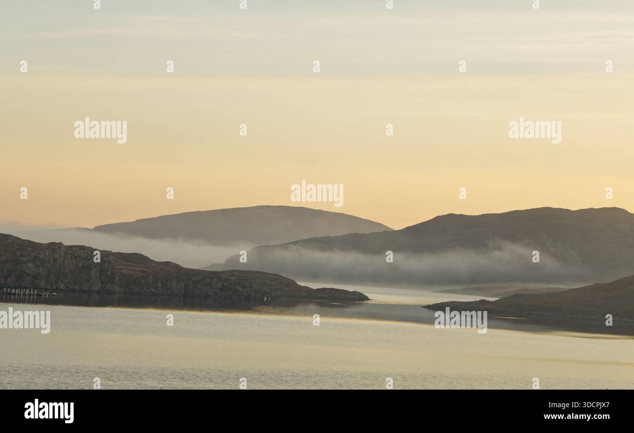 Loch roag golden sky with islands and fog hi-res stock photography and ...