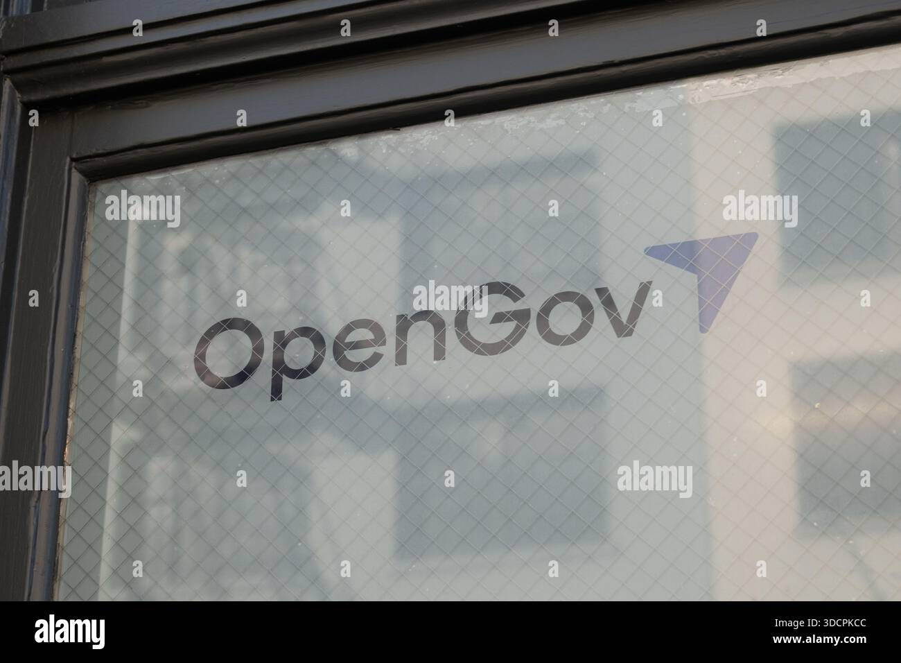 OpenGov office logo on frosted glass window with wire mesh pattern, San ...