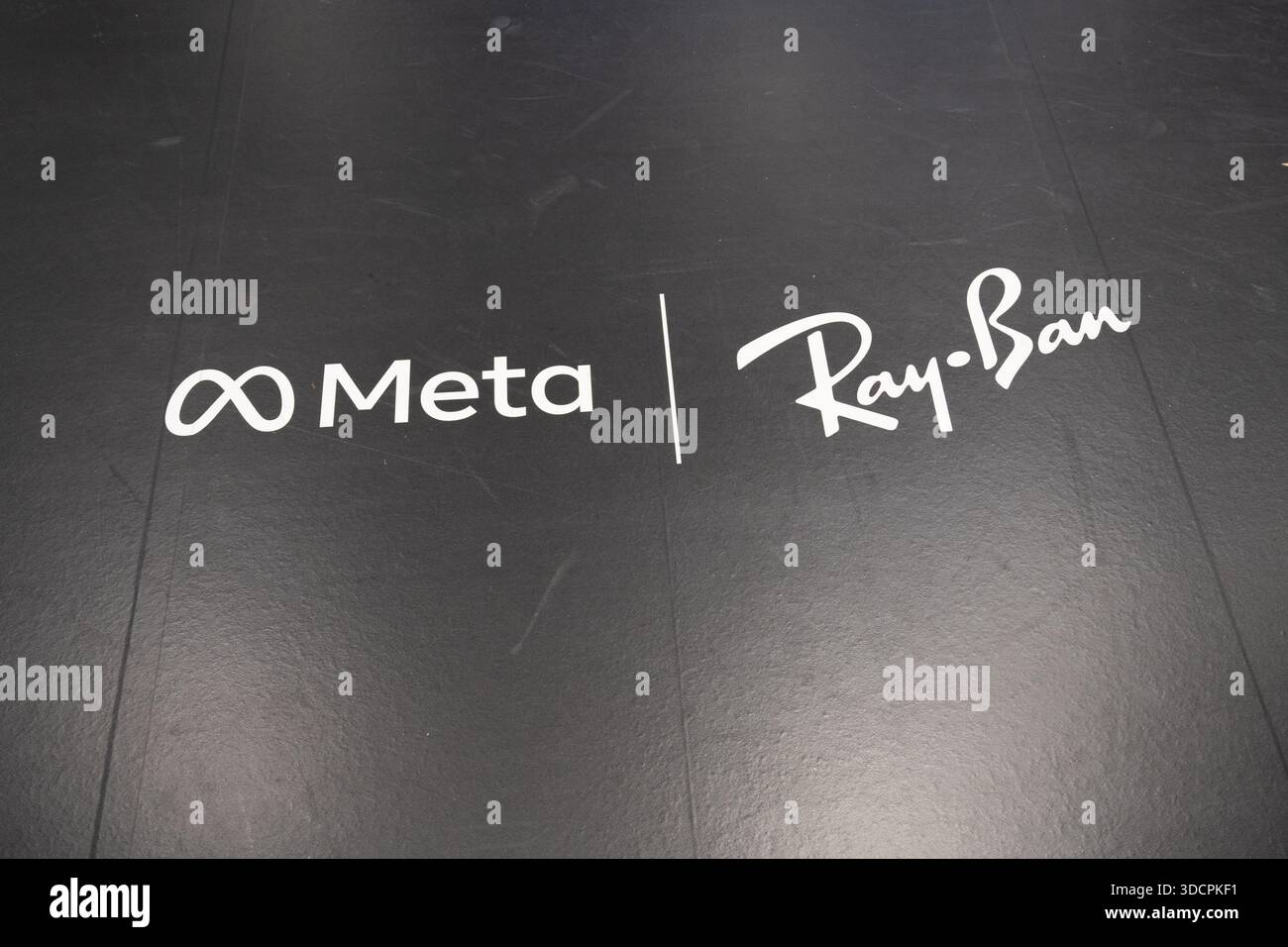 Meta and Ray-Ban co-branded logo printed on black textured surface, San ...