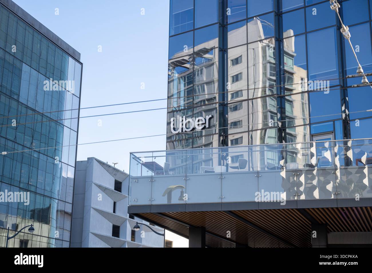 Uber office building exterior with glass facade and city reflections on ...