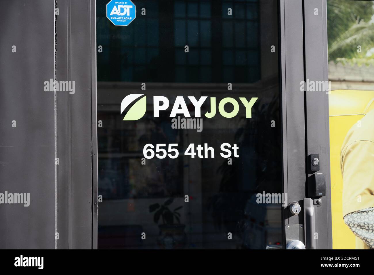 Entrance door with PayJoy logo and street address visible on glass, San ...