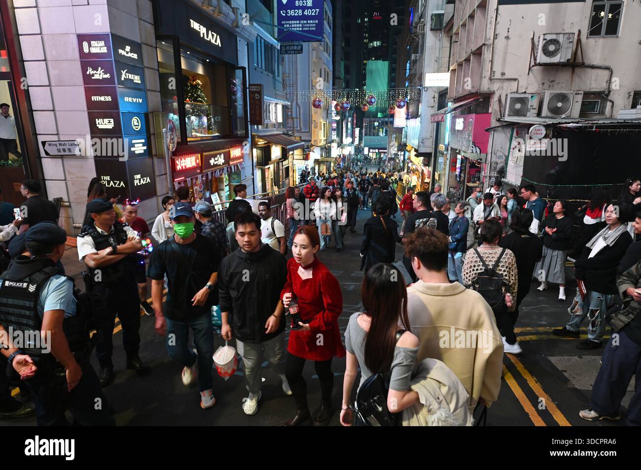 The visitors walking at the Lan Kwai Fong in Central on December 24 ...
