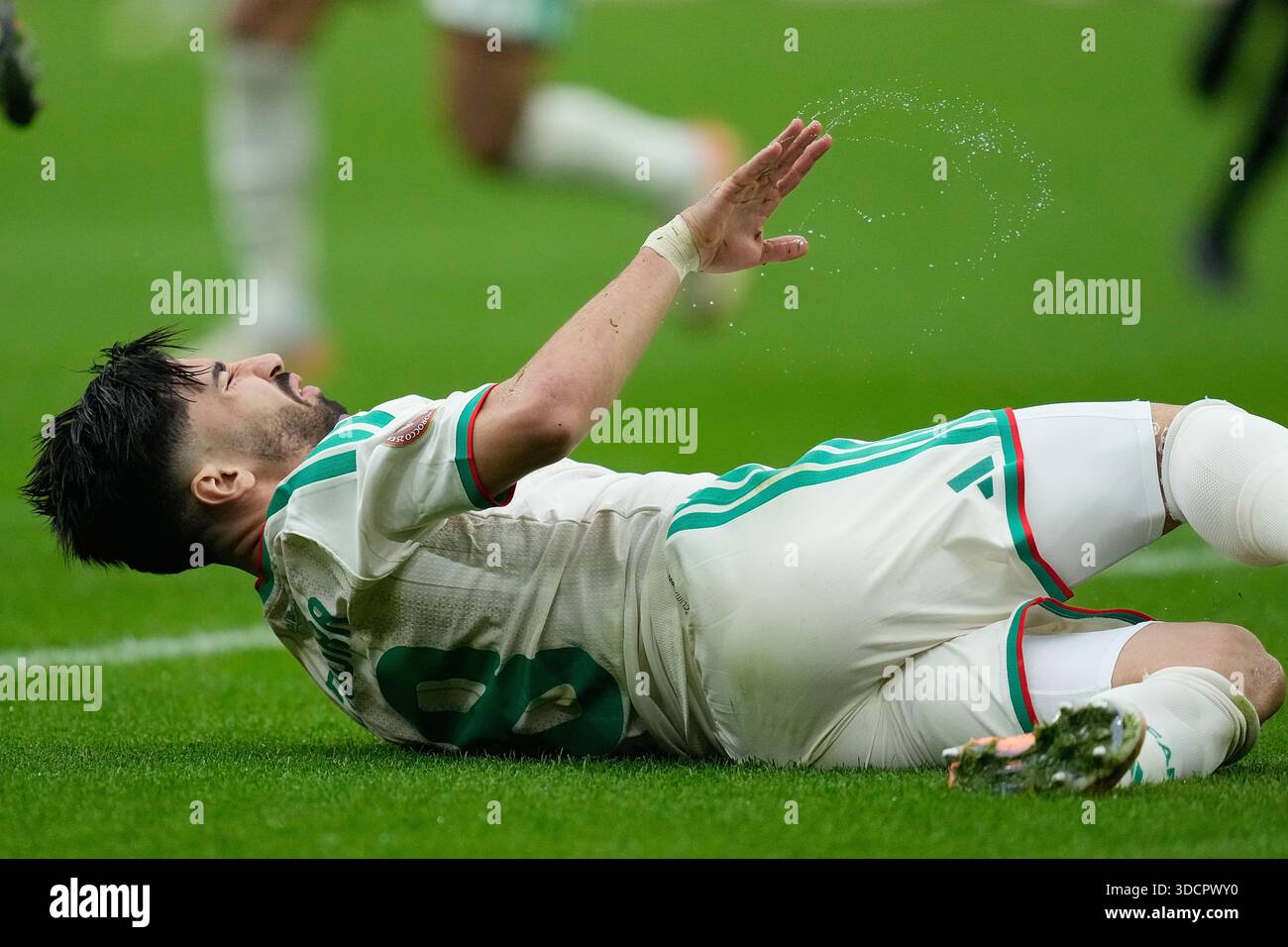 Algeria's Mohamed Amoura falls during the Africa Cup of Nations group E ...