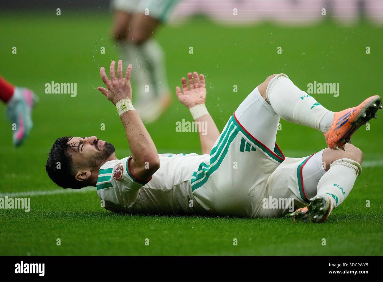 Algeria's Mohamed Amoura falls during the Africa Cup of Nations group E ...
