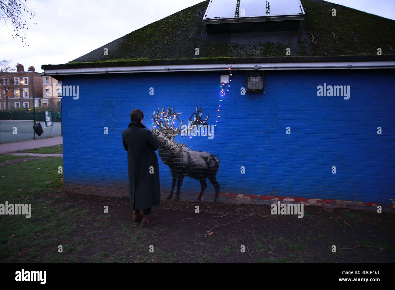ondon, UK. 24 December 2025. A new Christmas mural depicting a reindeer ...