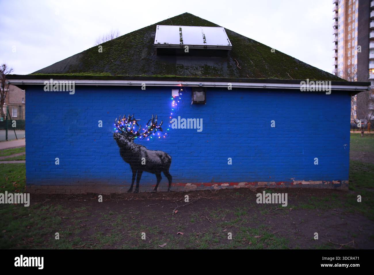 ondon, UK. 24 December 2025. A new Christmas mural depicting a reindeer ...