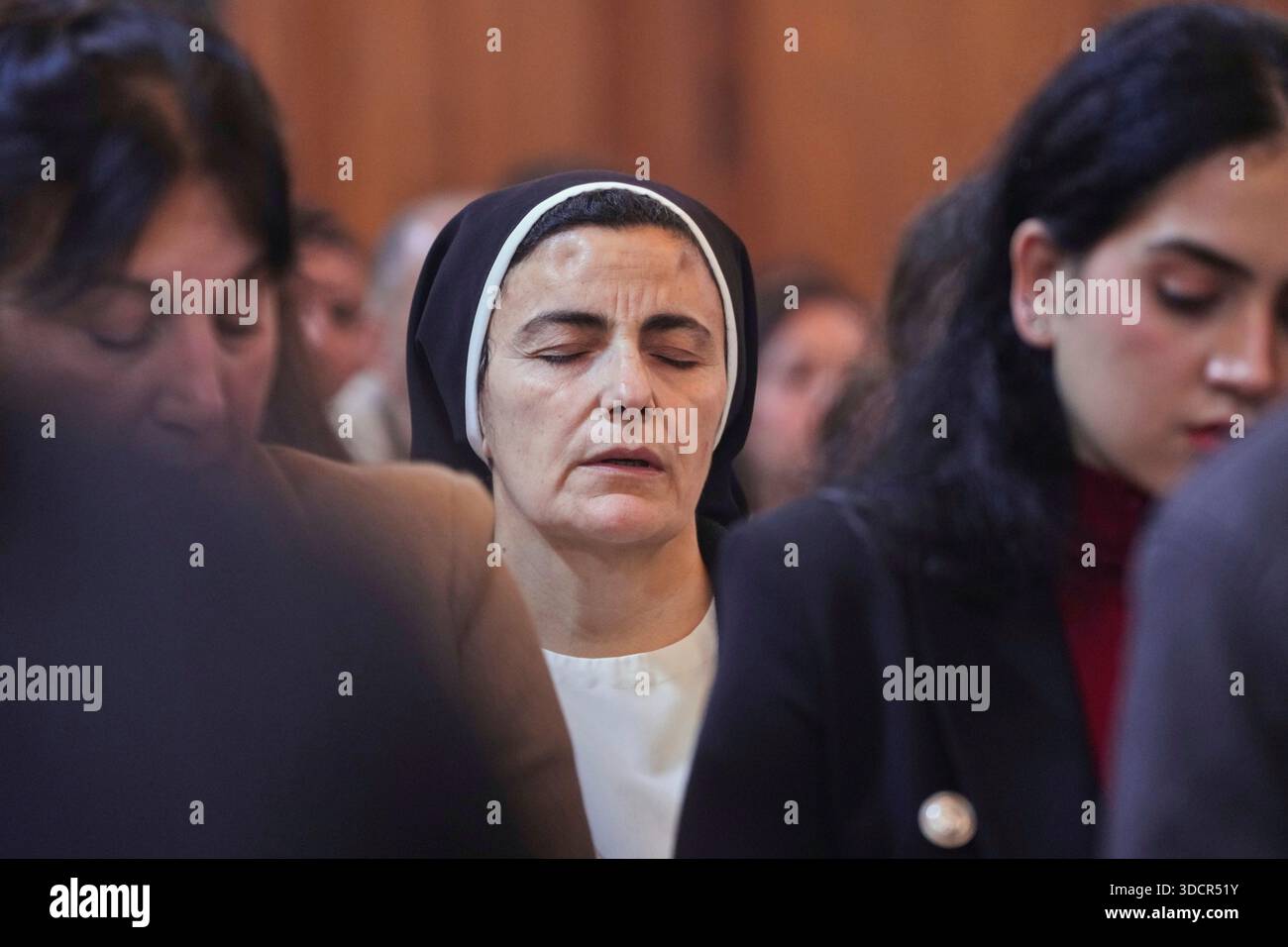 Iraqi Christians attend a Christmas Eve Mass at Our Lady of Salvation ...