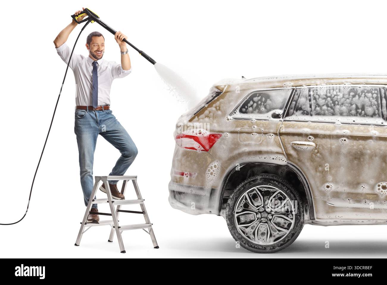 Man on a ladder washing a car with a high pressure machine isolated on ...