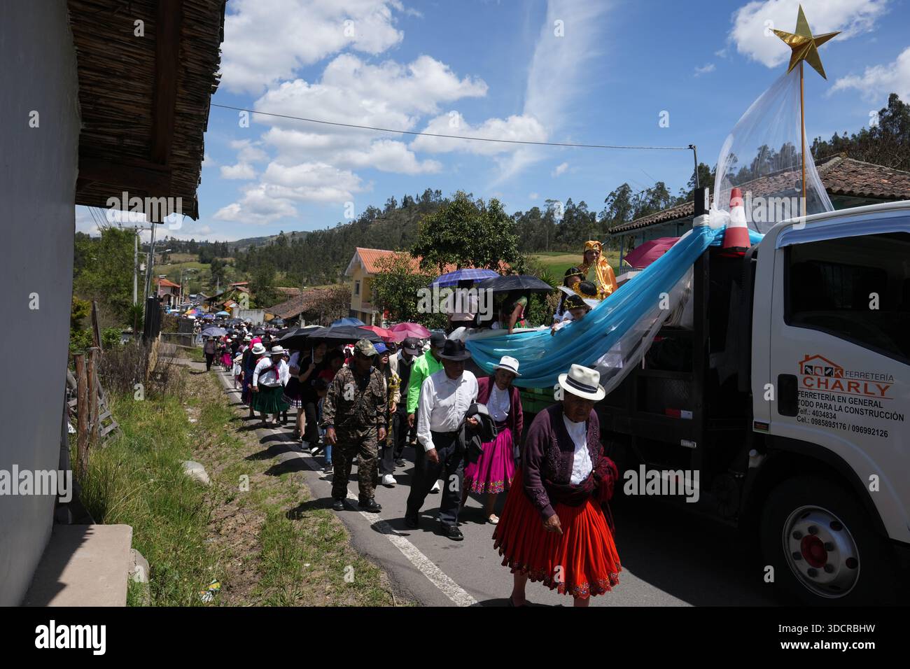 People talk part in a Christmas procession in Quingeo, Ecuador ...