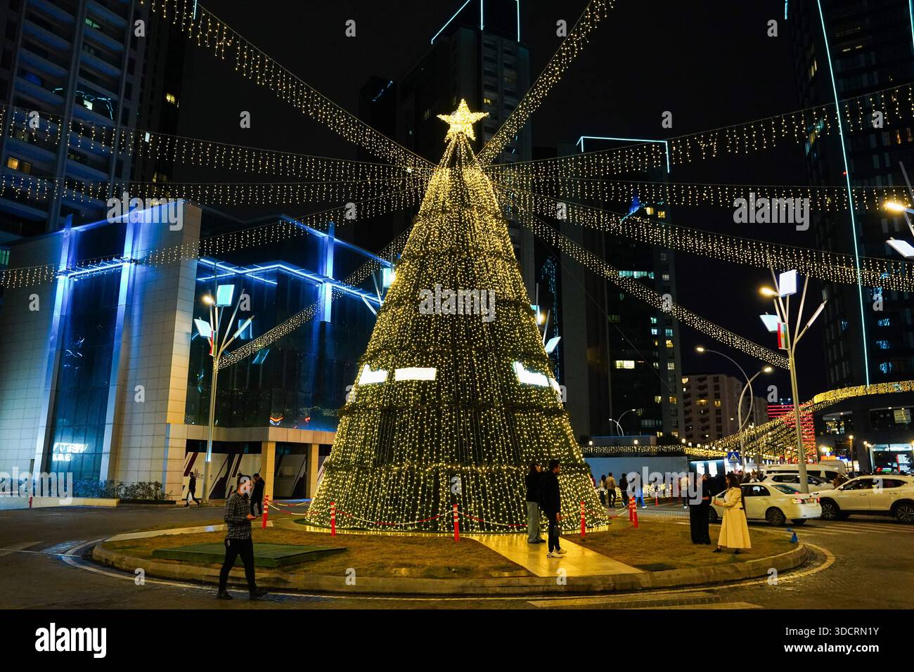 People seen walking near a Christmas tree at Empire Complex in ...