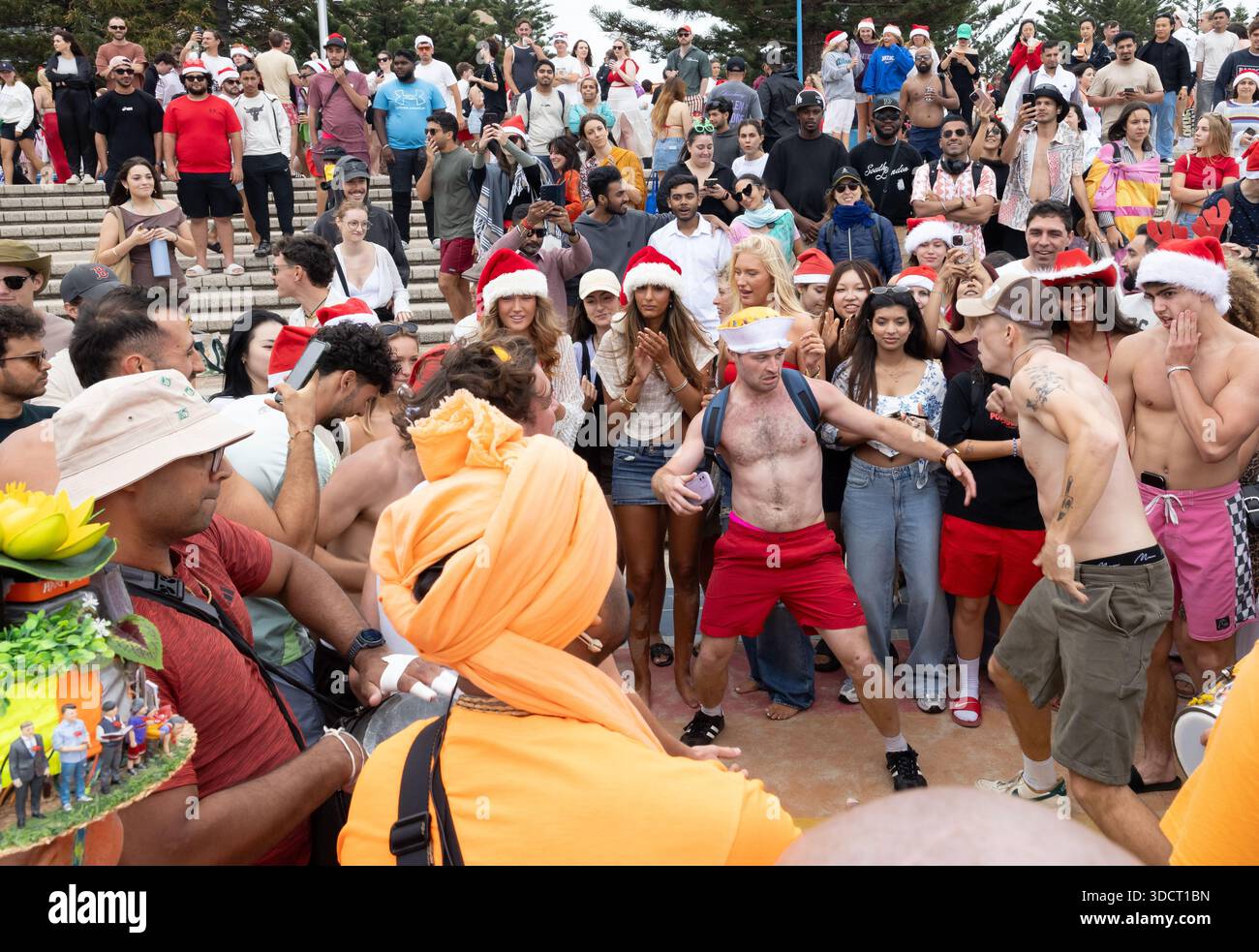 Revellers celebrate Christmas Day at Coogee Beach in Sydney, Thursday ...