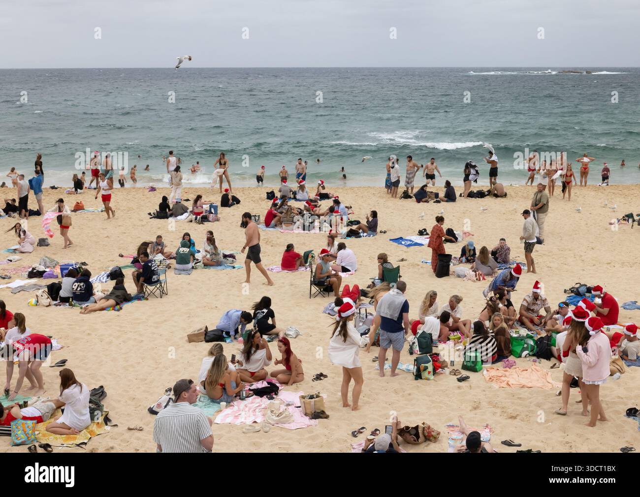 Revellers celebrate Christmas Day at Coogee Beach in Sydney, Thursday ...
