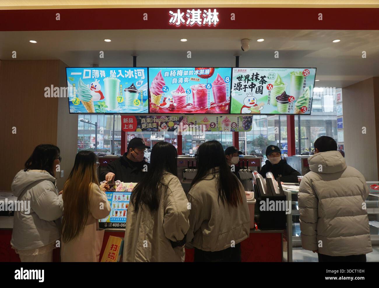 HANGZHOU, CHINA - DECEMBER 25, 2025 - Customers queue up to shop at ...
