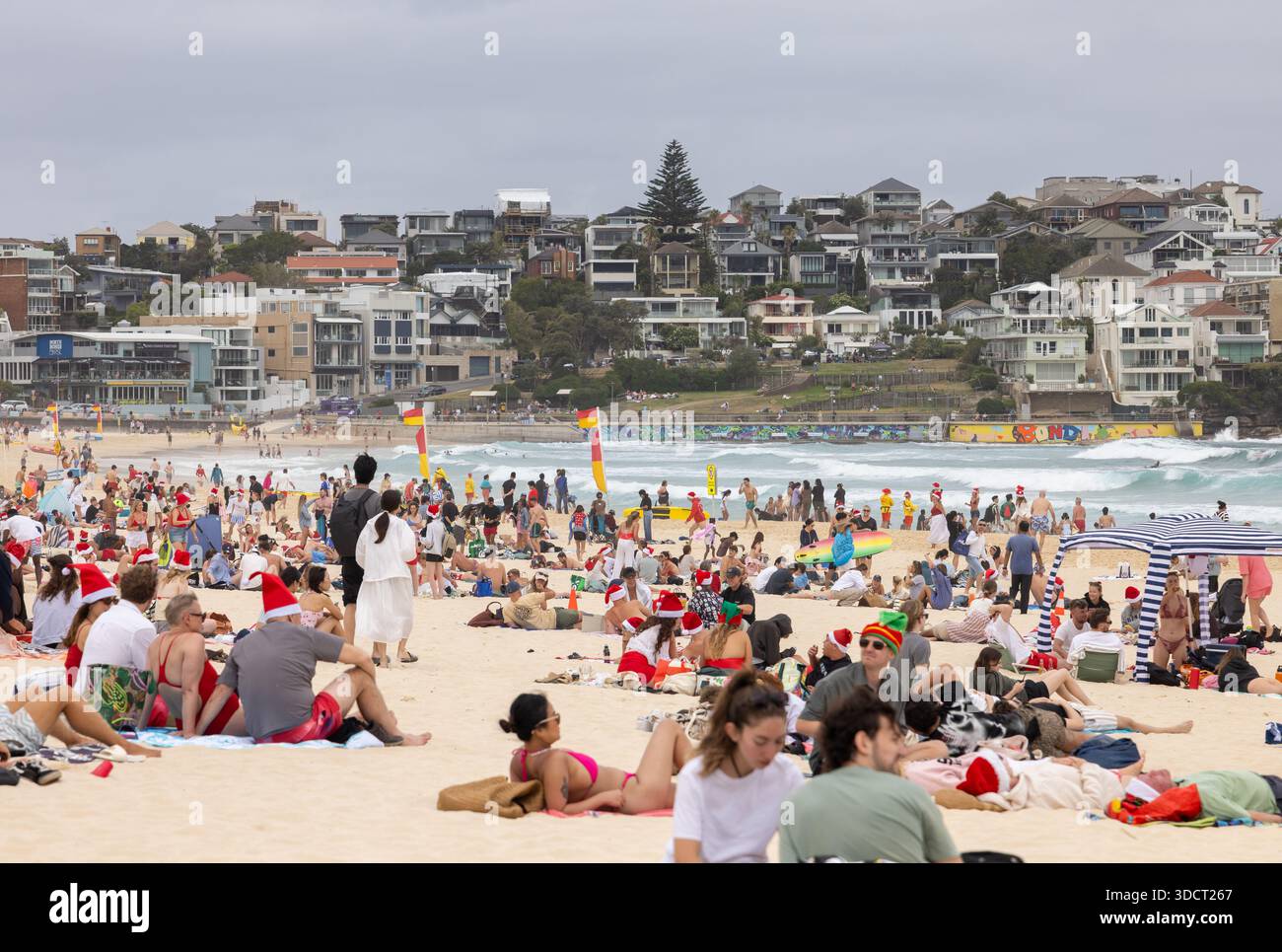 People gather on Christmas Day at Bondi Beach in Sydney, Thursday ...