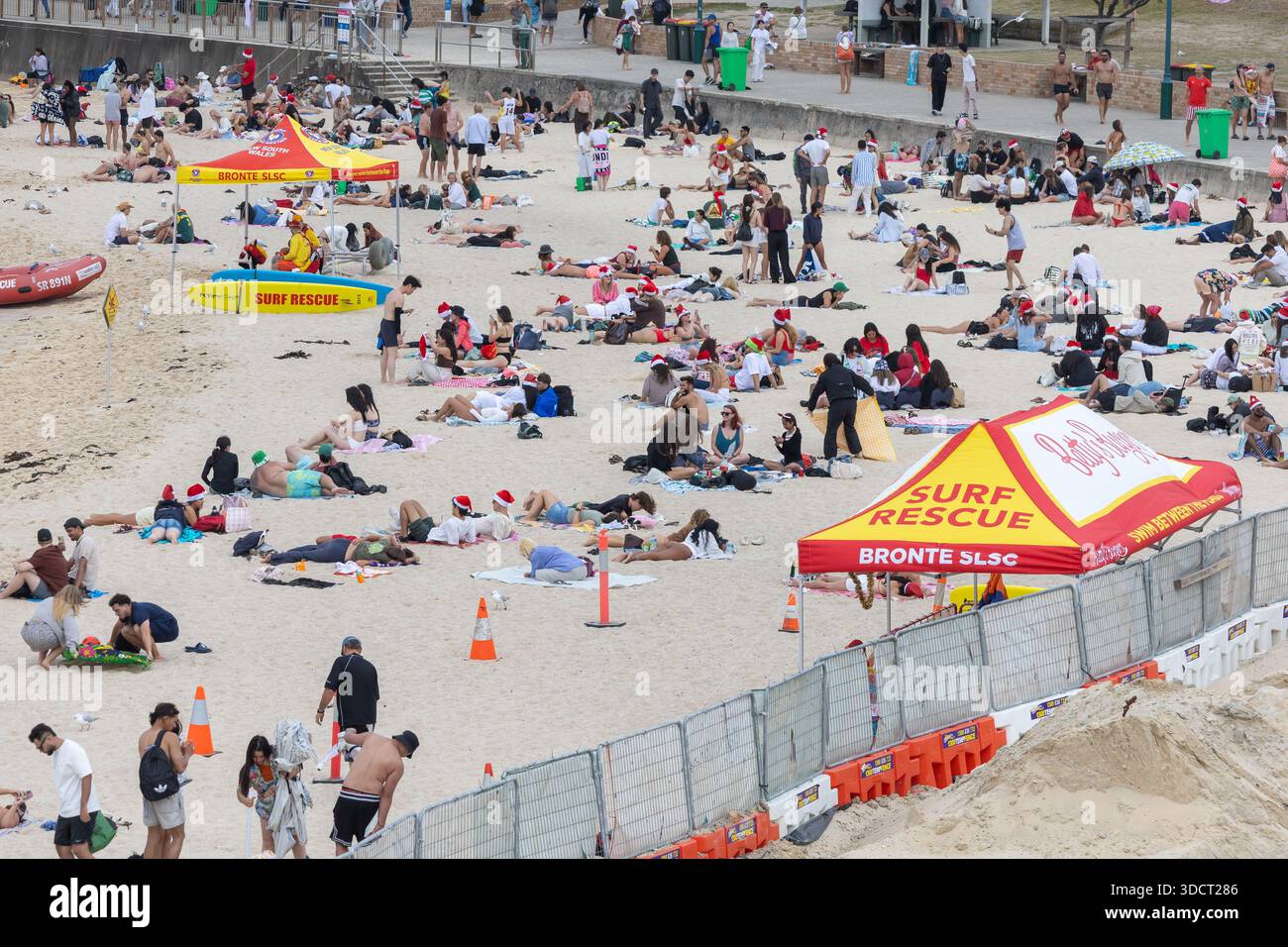 People gather on Christmas Day at Bronte Beach in Sydney, Thursday ...