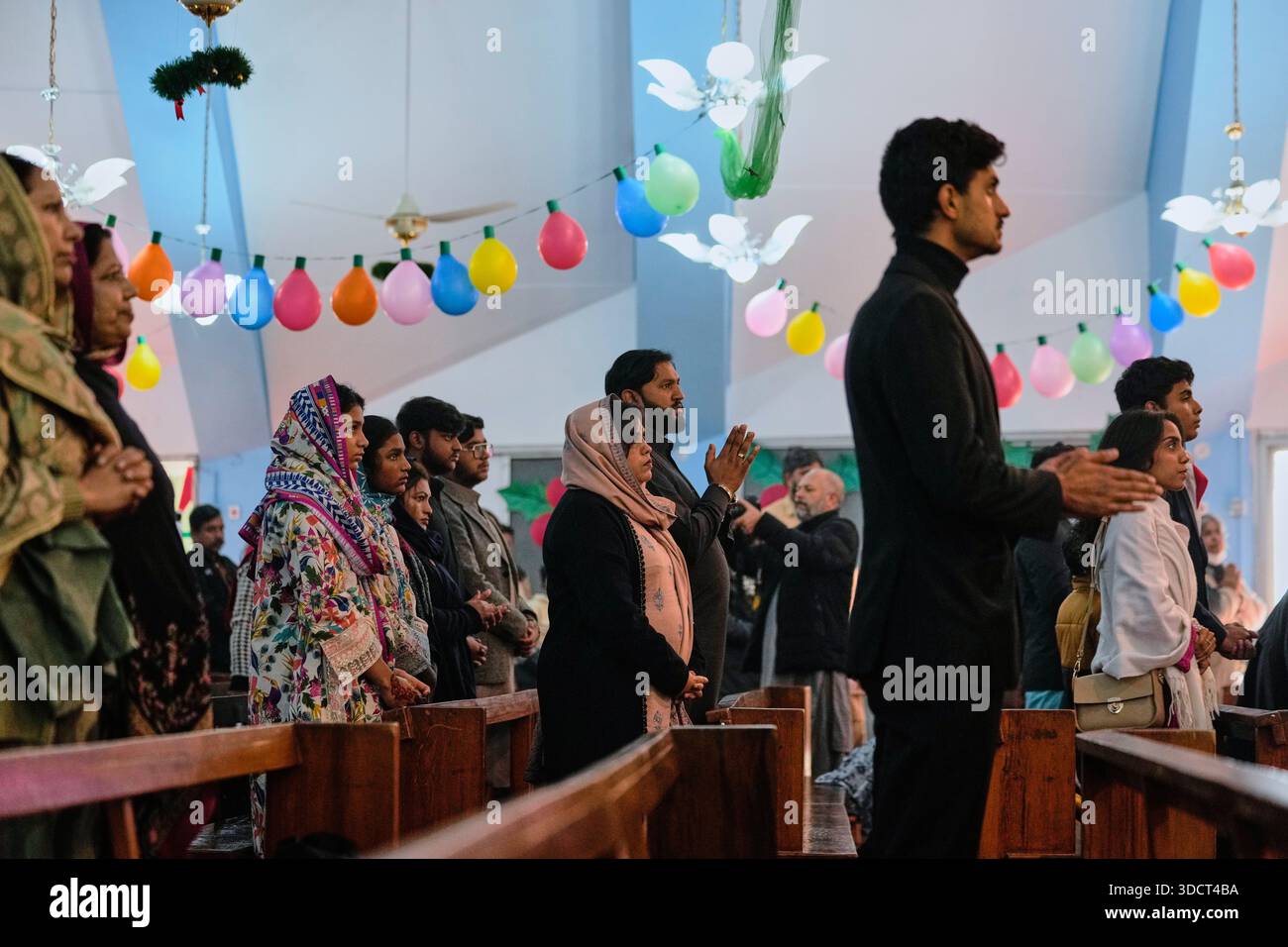 Christians attend Christmas Mass at the Our Lady of Fatima Church, in ...