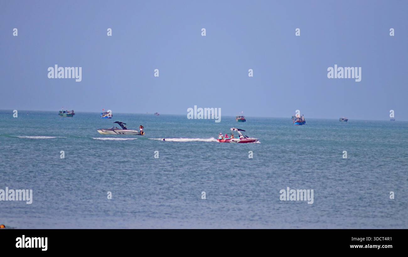 Tourists enjoy the sunny beaches during winter in Sanya, south China's ...