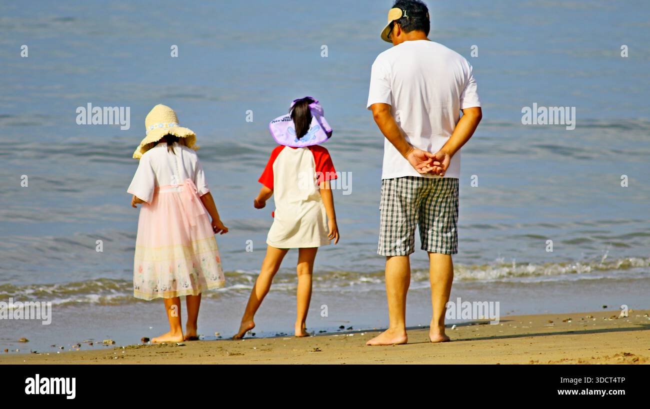Tourists enjoy the sunny beaches during winter in Sanya, south China's ...