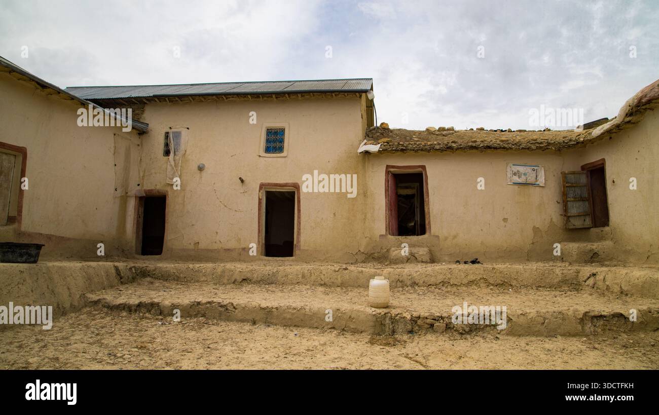Traditional earthen house in Morocco, with rammed earth walls, tin roof ...