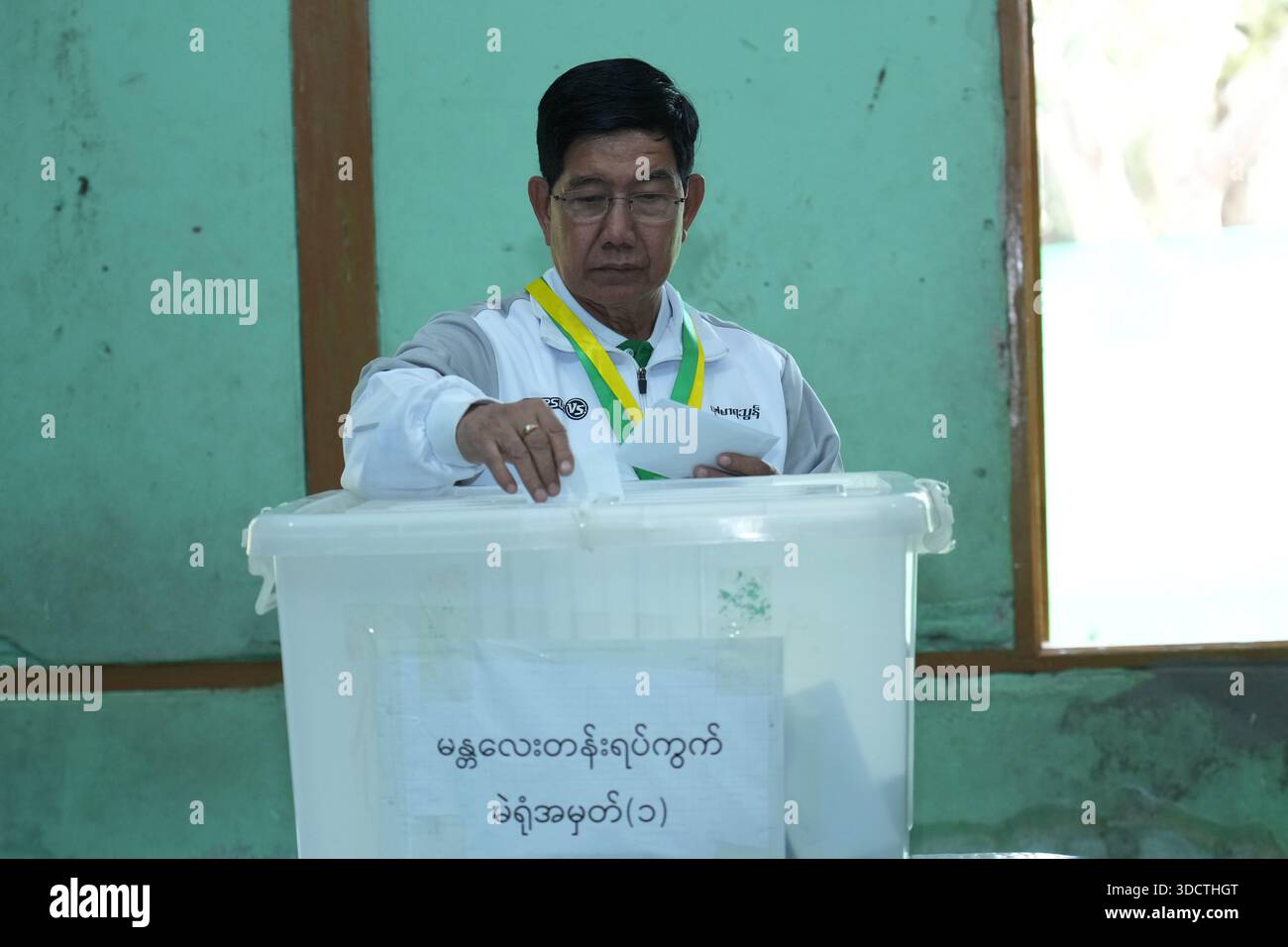 A man casts his advanced ballot at polling station opened at a school ...