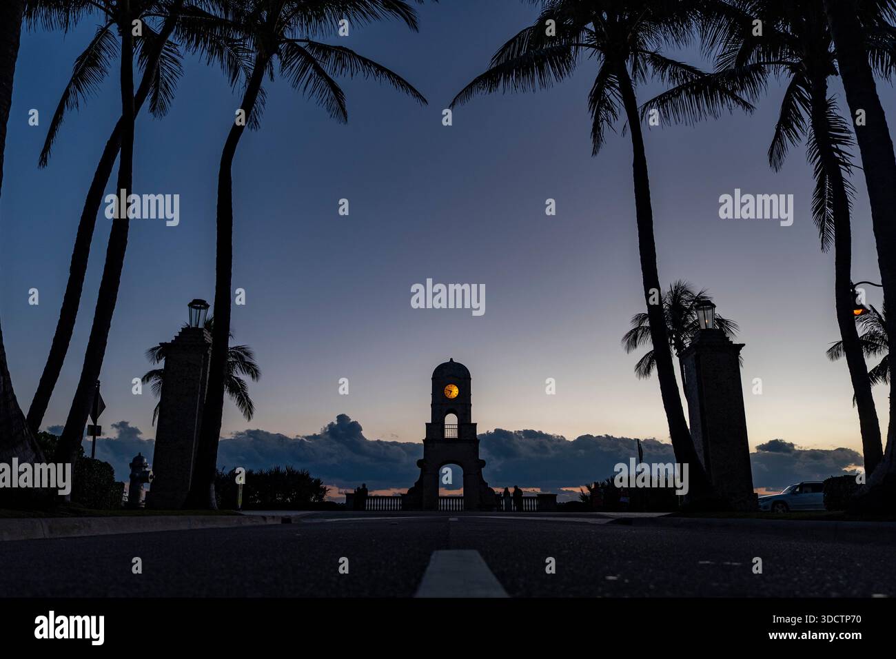 The sun rises behind the Worth Avenue Clock Tower on Christmas morning ...