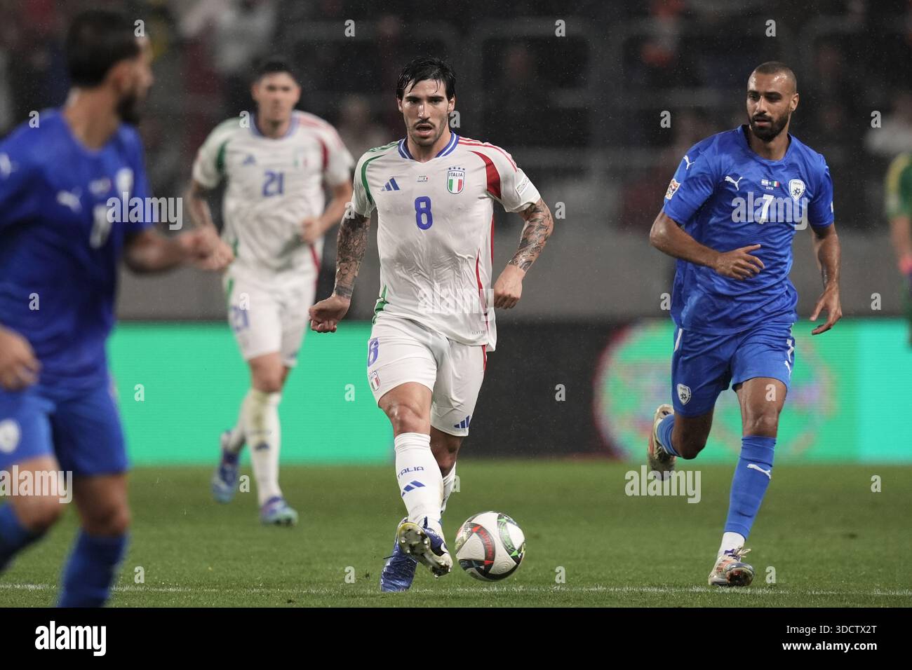 Italy's Sandro Tonali fights for the ball with Israel's Ramzi Safuri ...