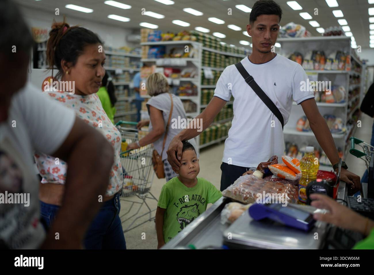 Mariela Gómez, her partner Abraham Castro, and her son Mathias, a ...